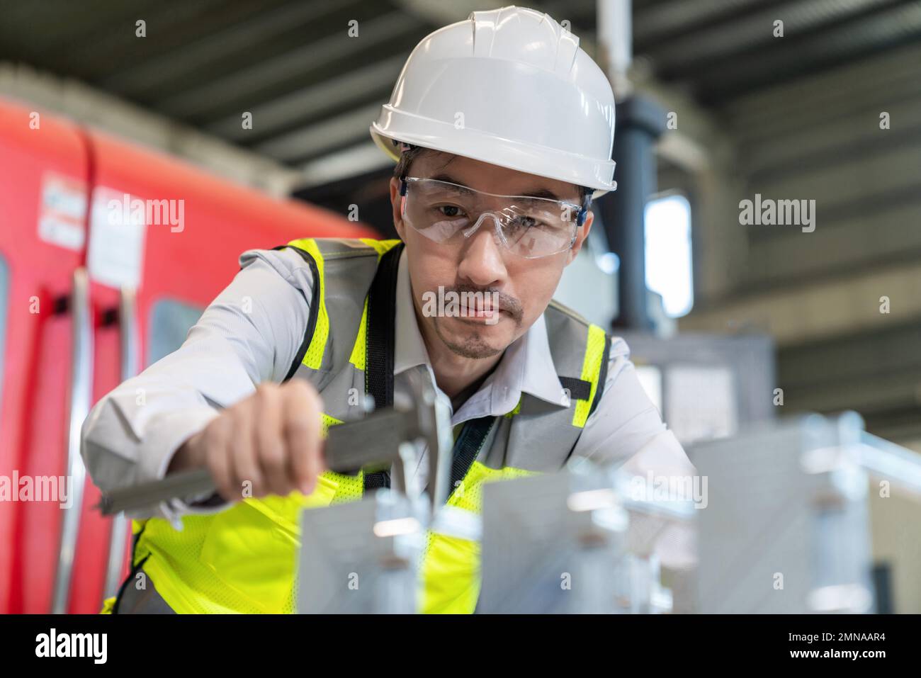 Engineers wear protective overalls wearing helmets working in the ...