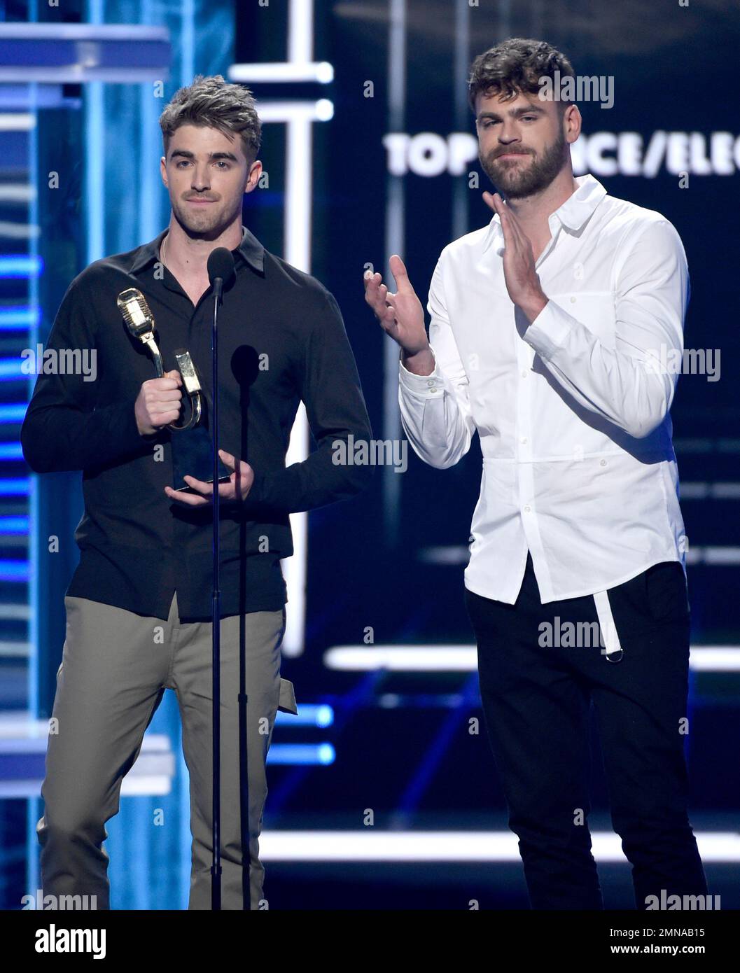 Andrew Taggart, left, and Alex Pall, of The Chainsmokers, accept the ...