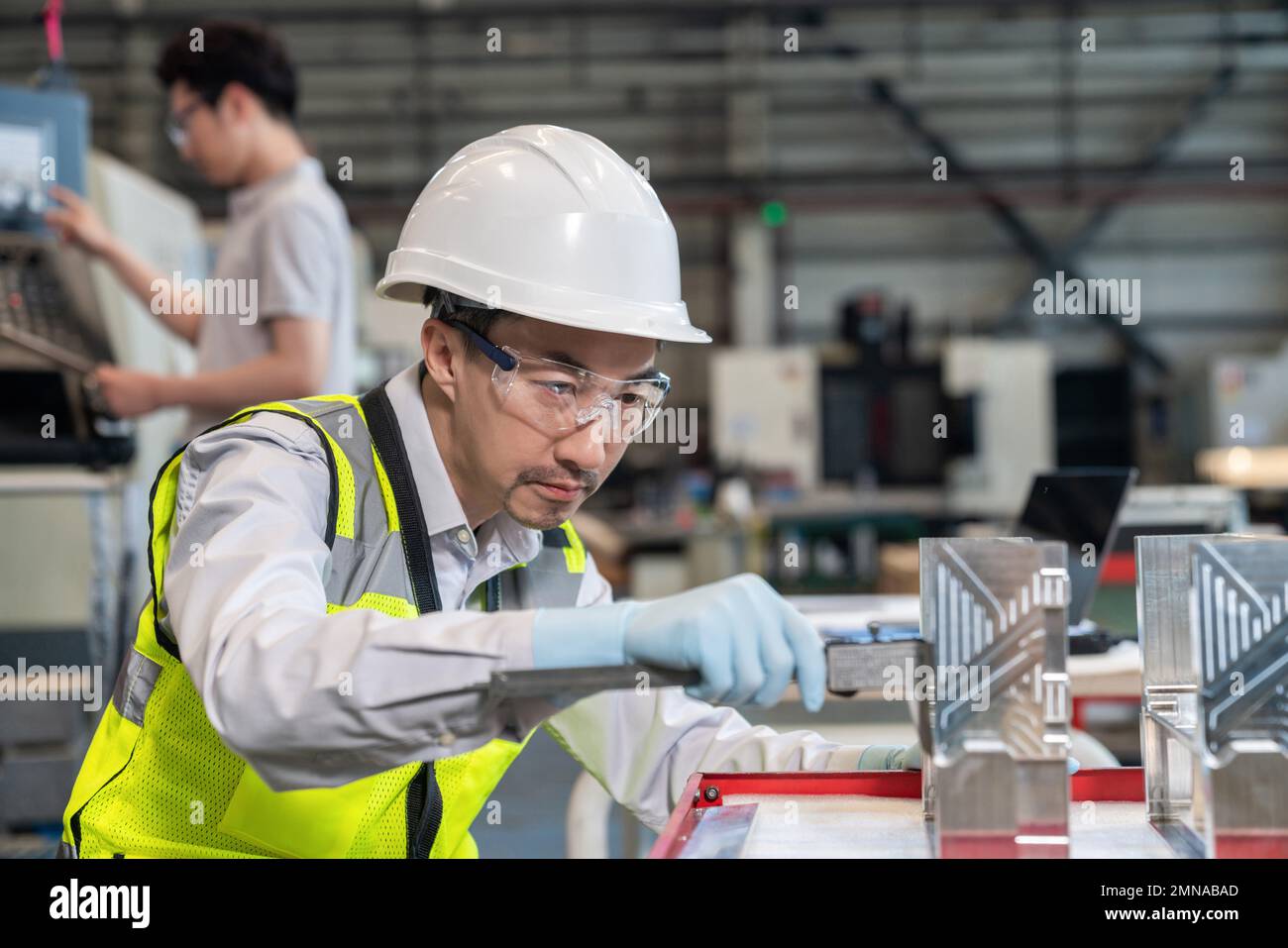 Engineers wear protective overalls wearing helmets working in the ...