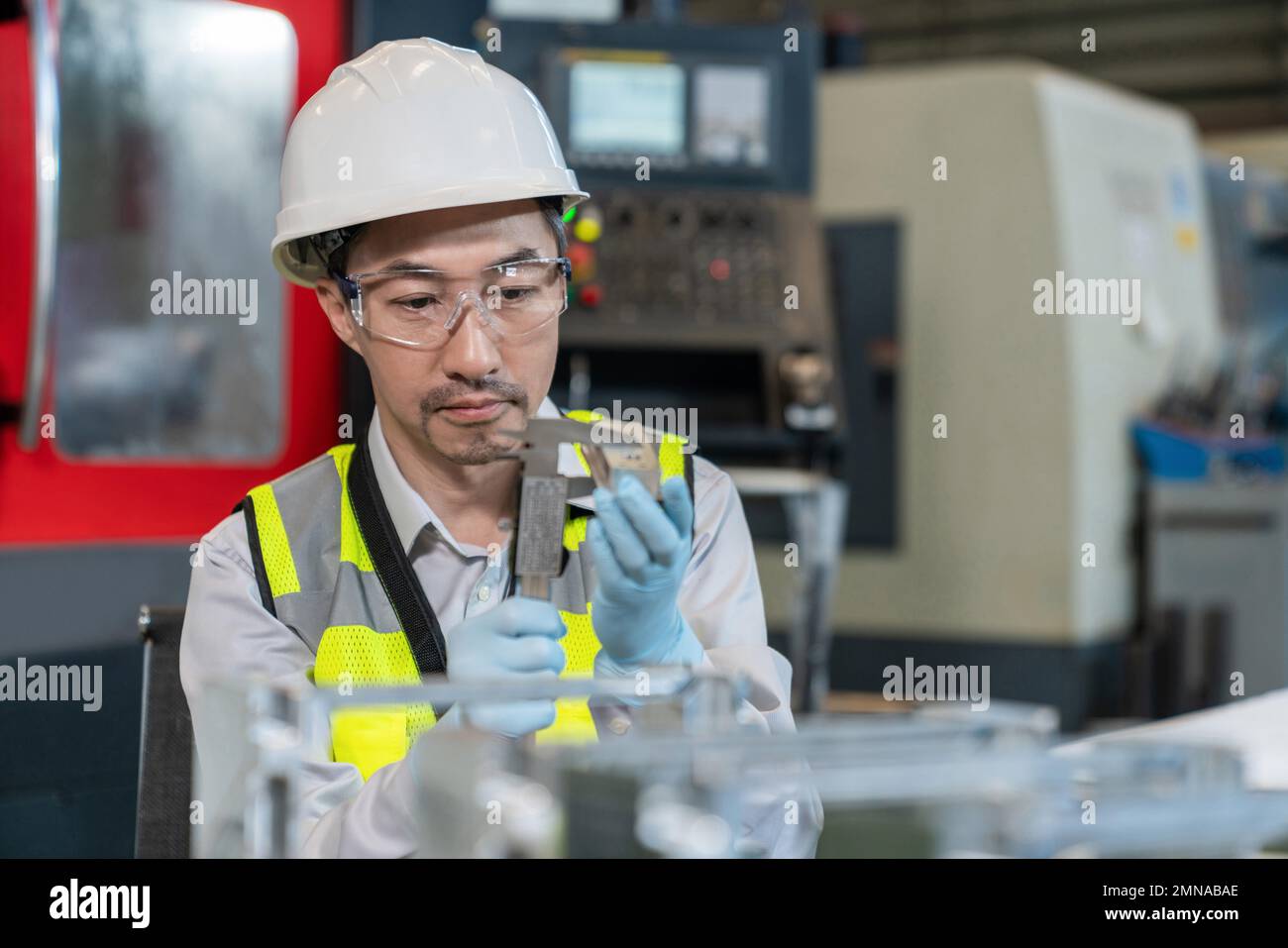 Engineers wear protective overalls wearing helmets working in the ...