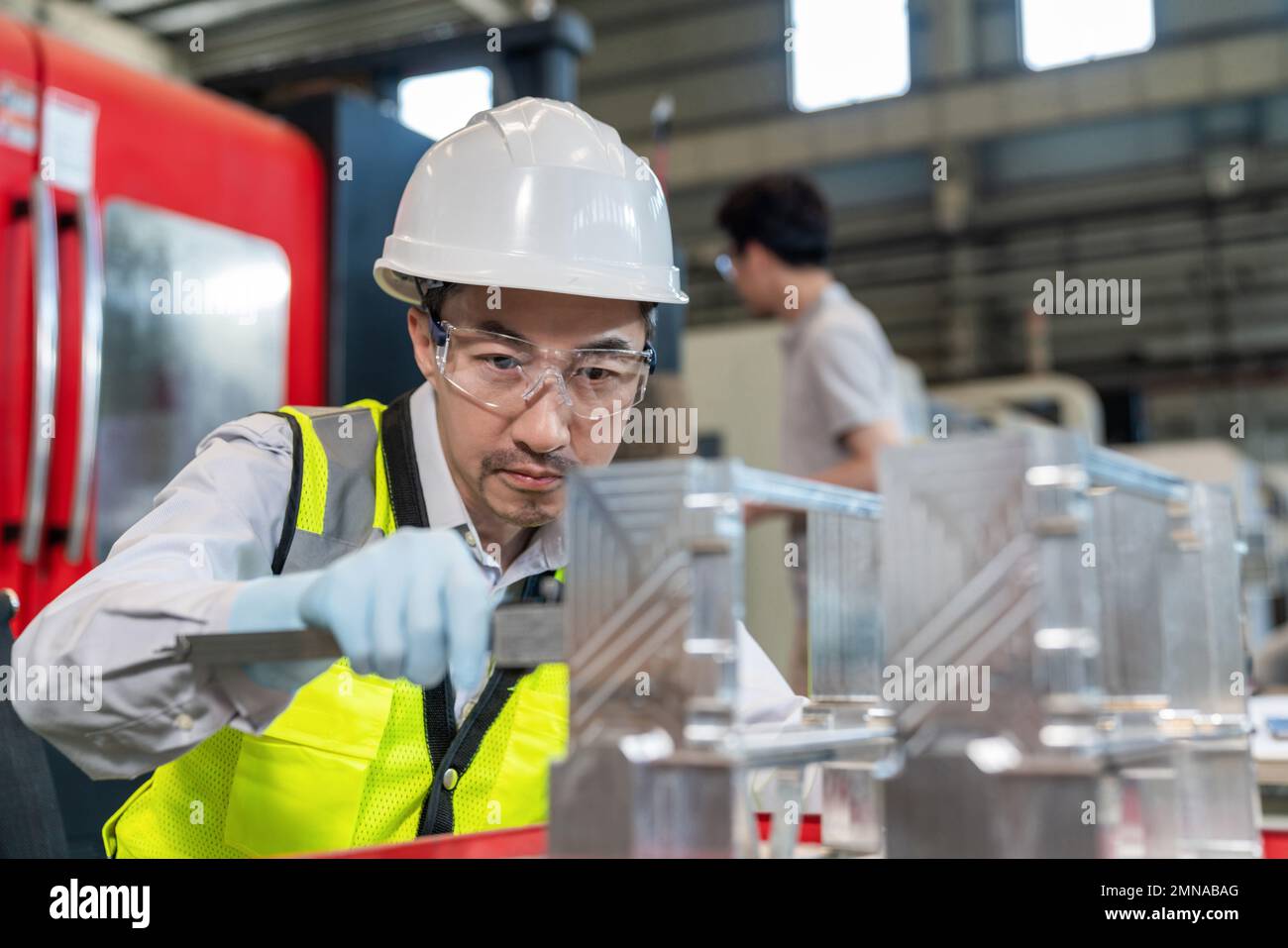 Engineers wear protective overalls wearing helmets working in the ...