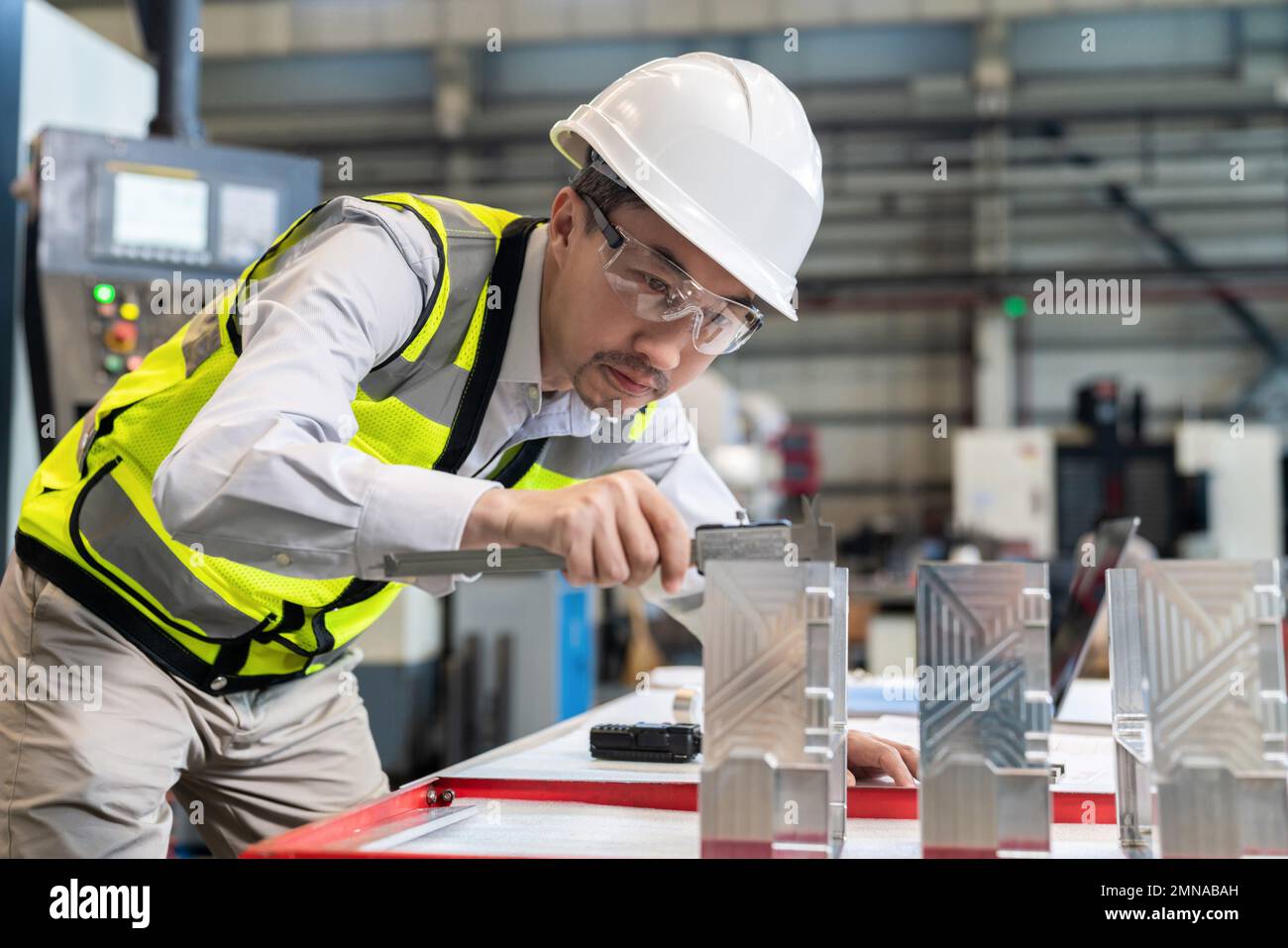 Engineers wear protective overalls wearing helmets working in the ...