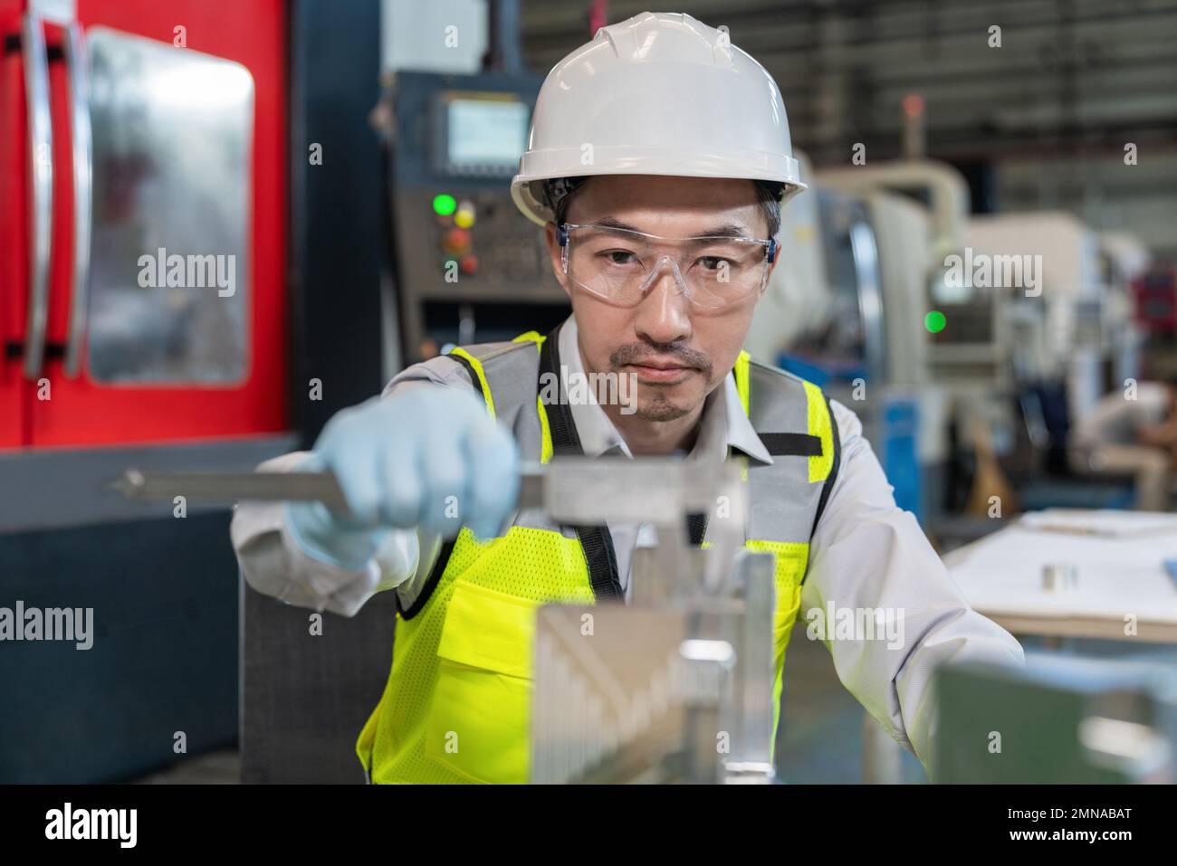 Engineers wear protective overalls wearing helmets working in the ...