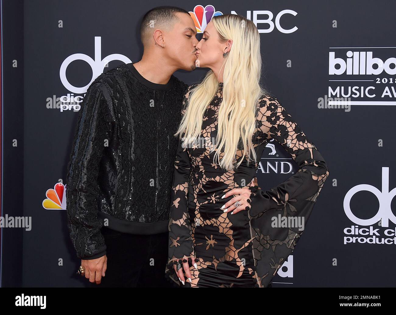 Evan Ross, left, and Ashlee Simpson Ross kiss as they arrive at the ...