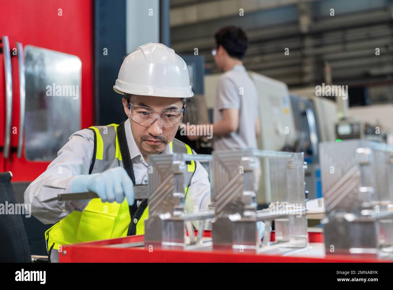 Engineers wear protective overalls wearing helmets working in the ...