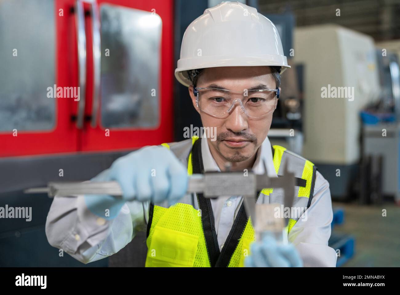 Engineers wear protective overalls wearing helmets working in the ...