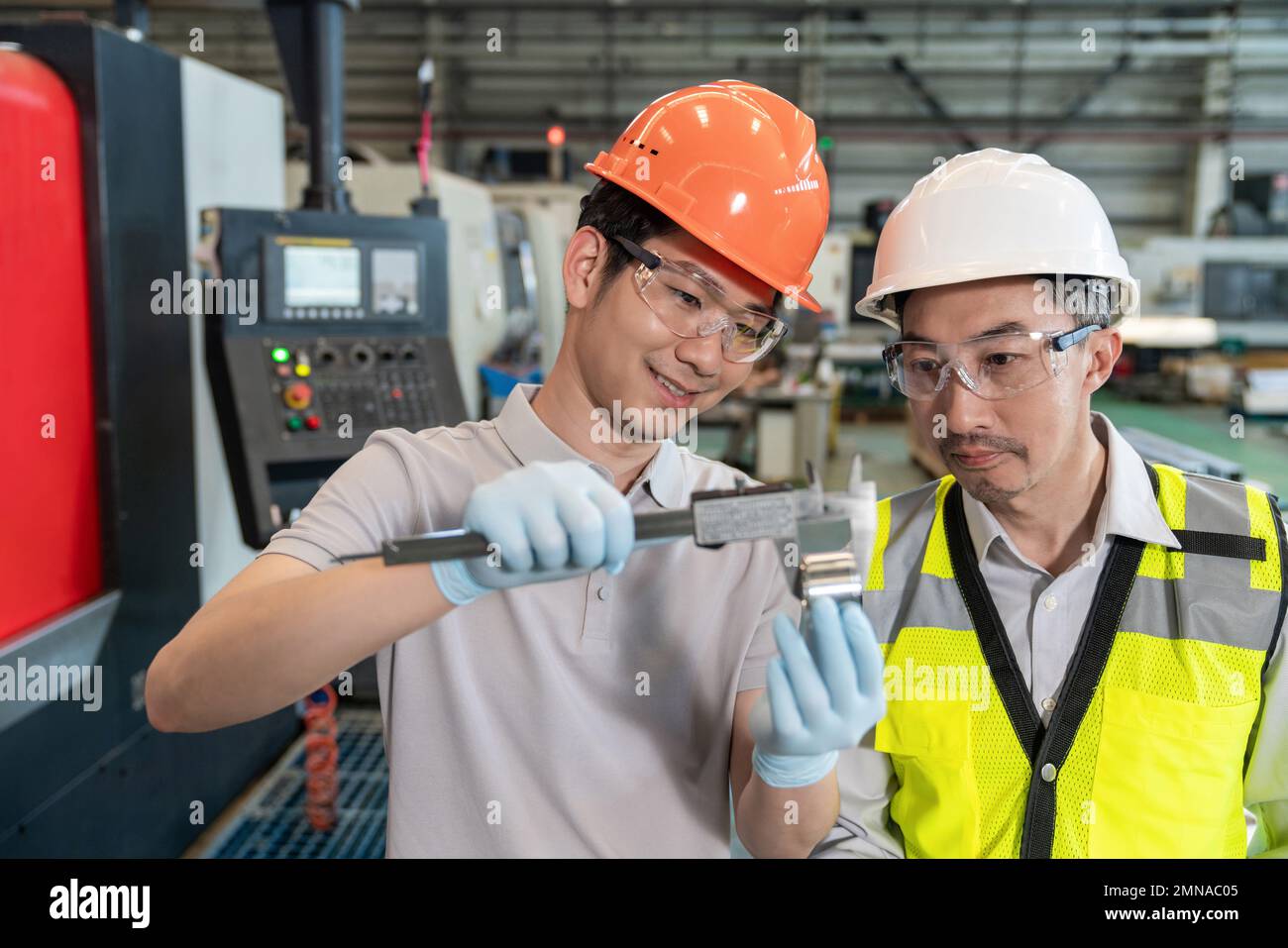 Wearing helmets and work clothes hi-res stock photography and images ...