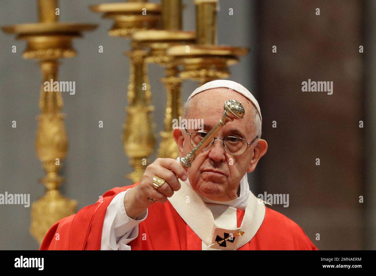 Pope Francis asperges holy water as he celebrates a Pentecost mass in ...
