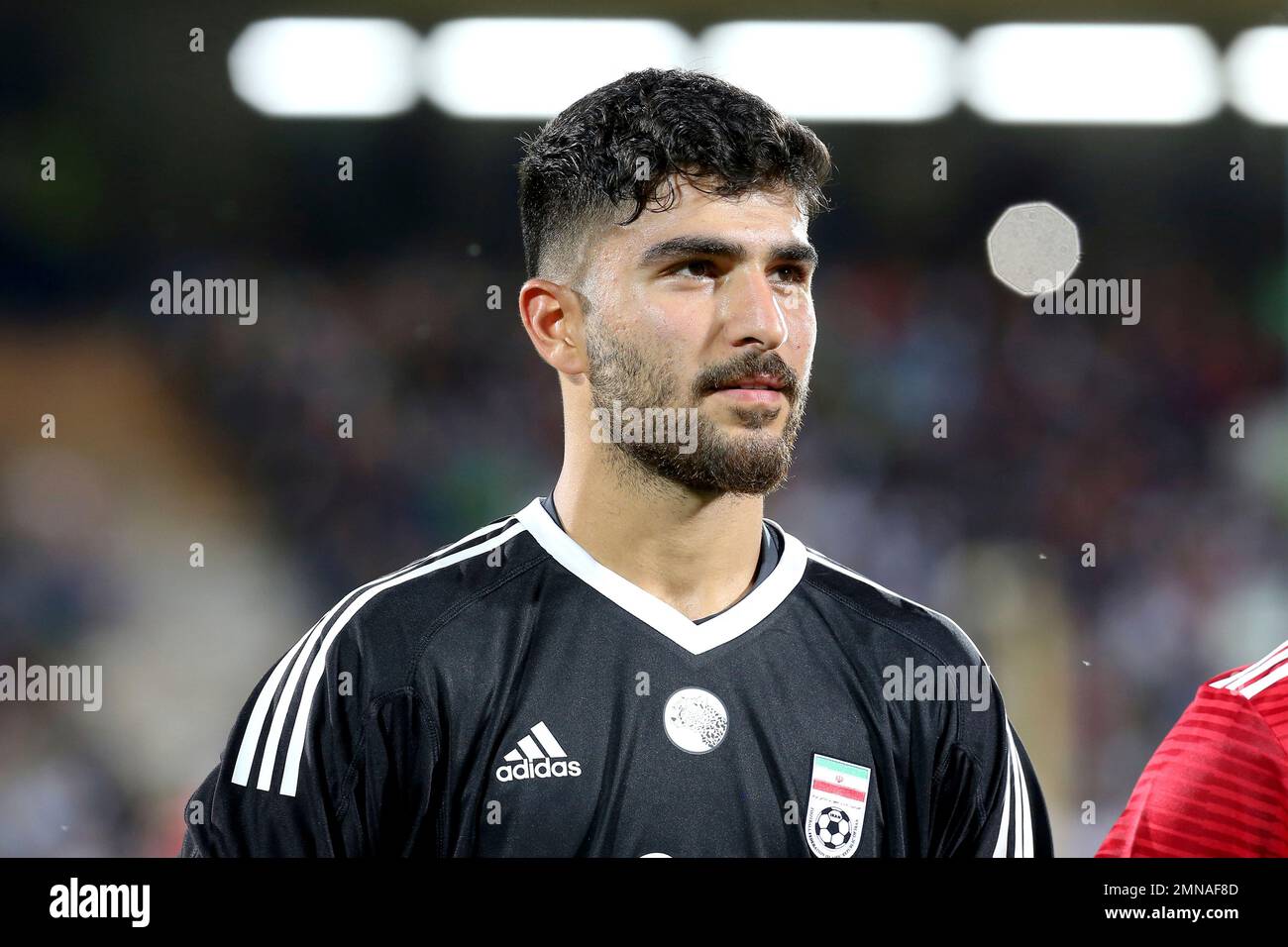 Iran's goalkeeper Amir Abedzadeh listens to the national anthem before ...