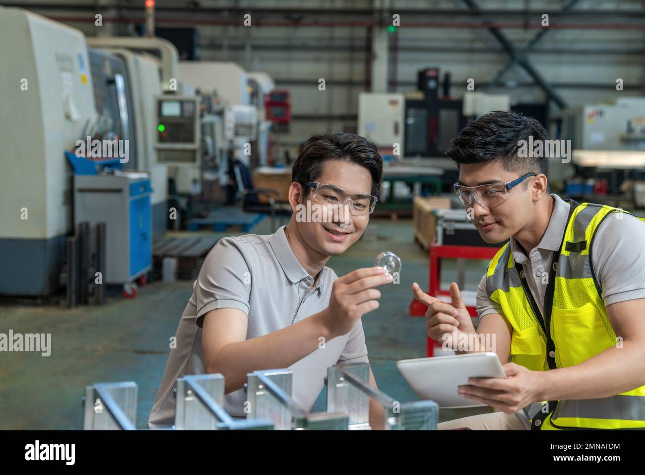 Two engineers at the factory to do measurement Stock Photo - Alamy