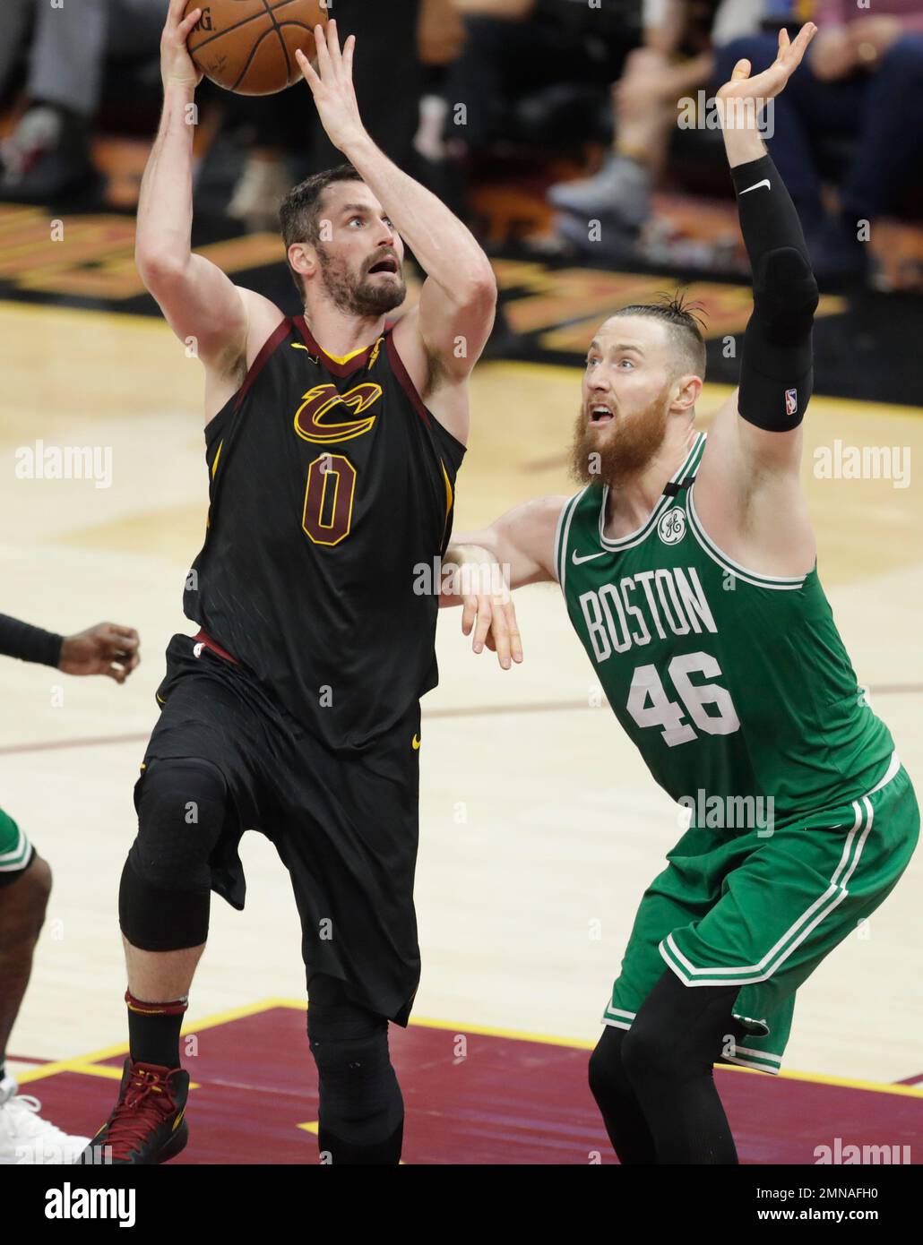 Cleveland Cavaliers' Kevin Love (0) shoots over Boston Celtics' Aron ...
