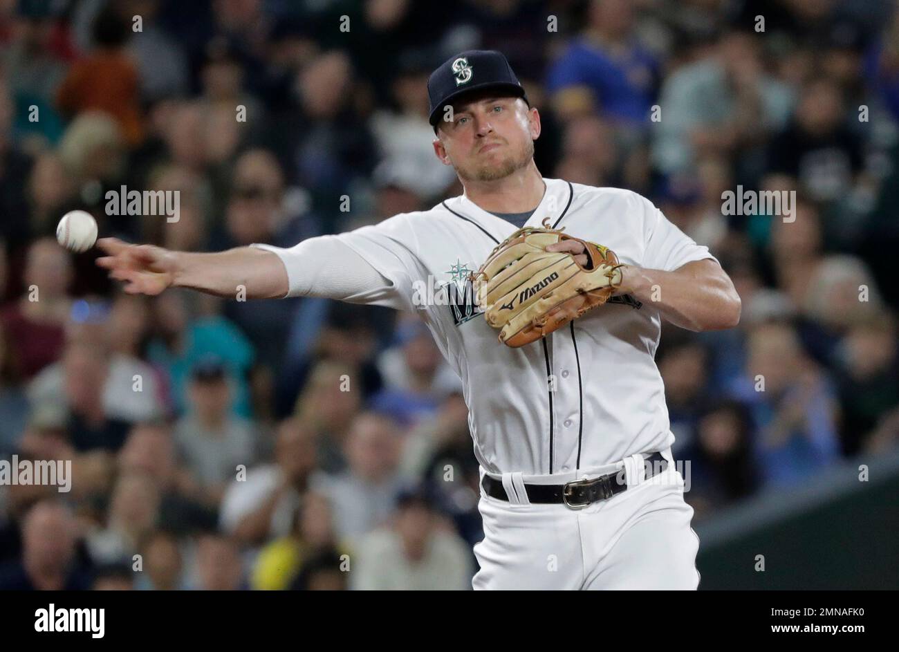 Seattle Mariners third baseman Kyle Seager throws to first base on a ...