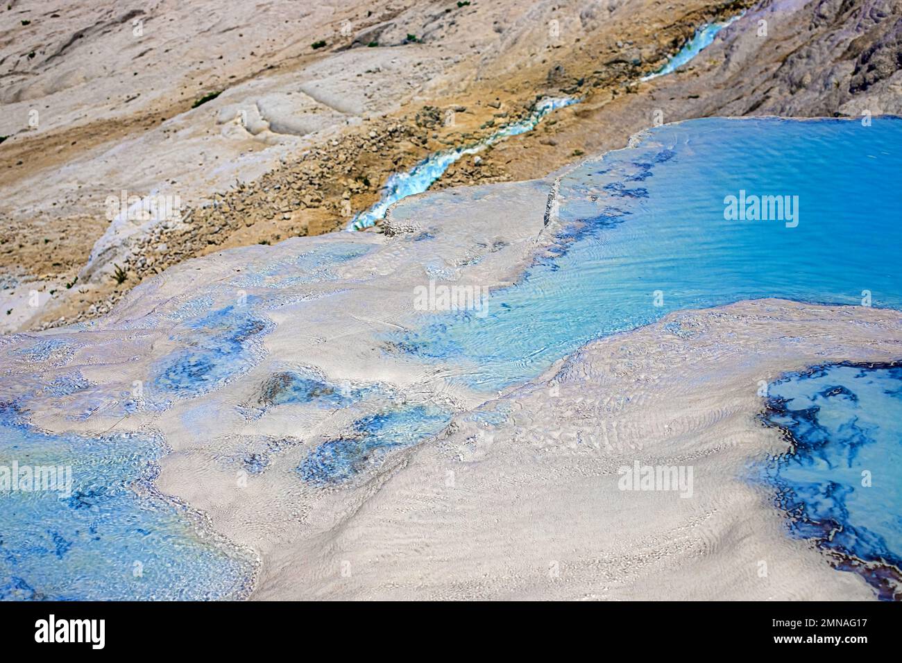View of natural terraces in Pamukkale on a summer day. Close-up texture ...
