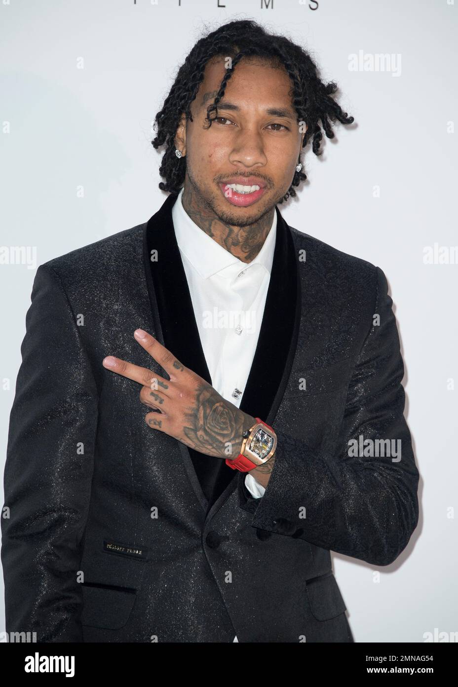 Tyga poses for photographers upon arrival at the amfAR, Cinema Against ...