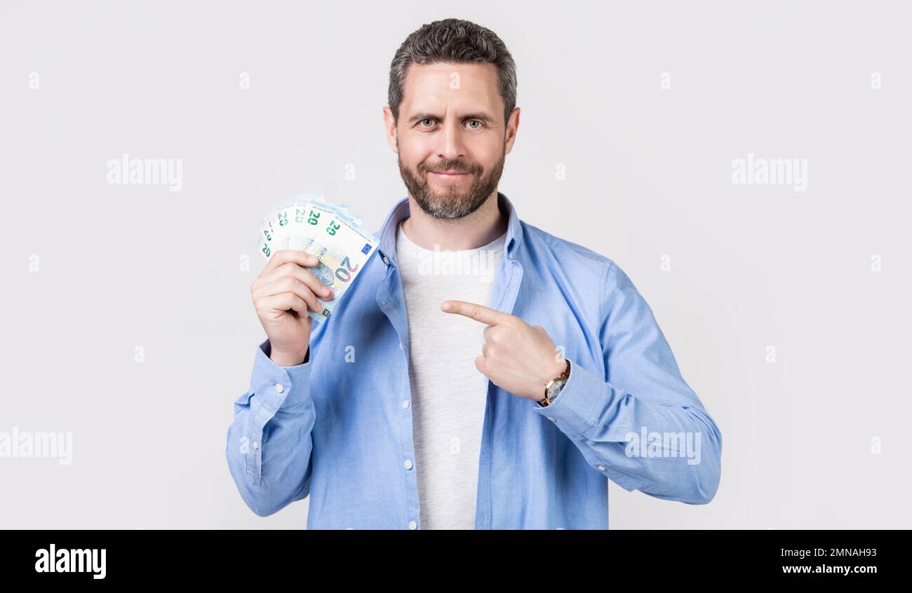 man point finger on salary money banknotes. photo of man with salary ...