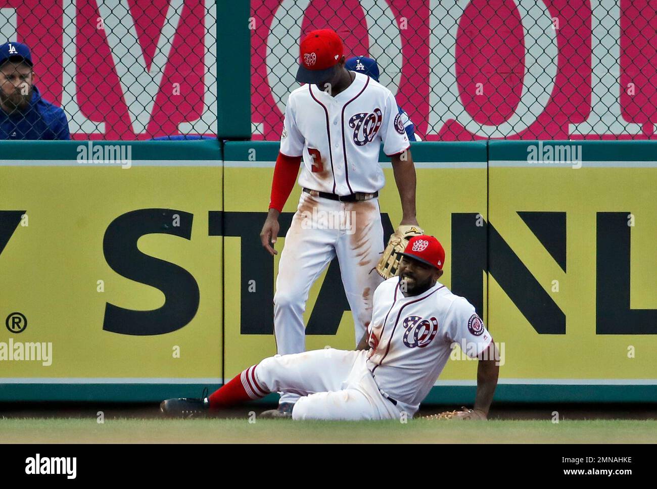 Washington Nationals left fielder Howie Kendrick reacts after an injury ...