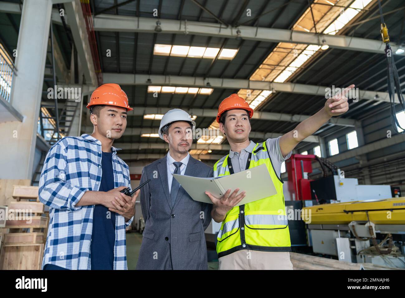 Three architects in the work Stock Photo - Alamy