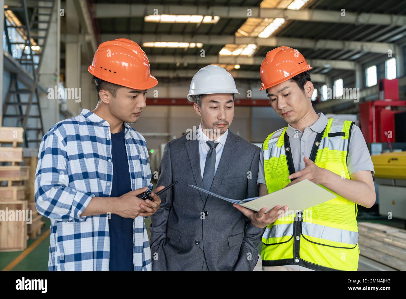Three architects in the work Stock Photo - Alamy