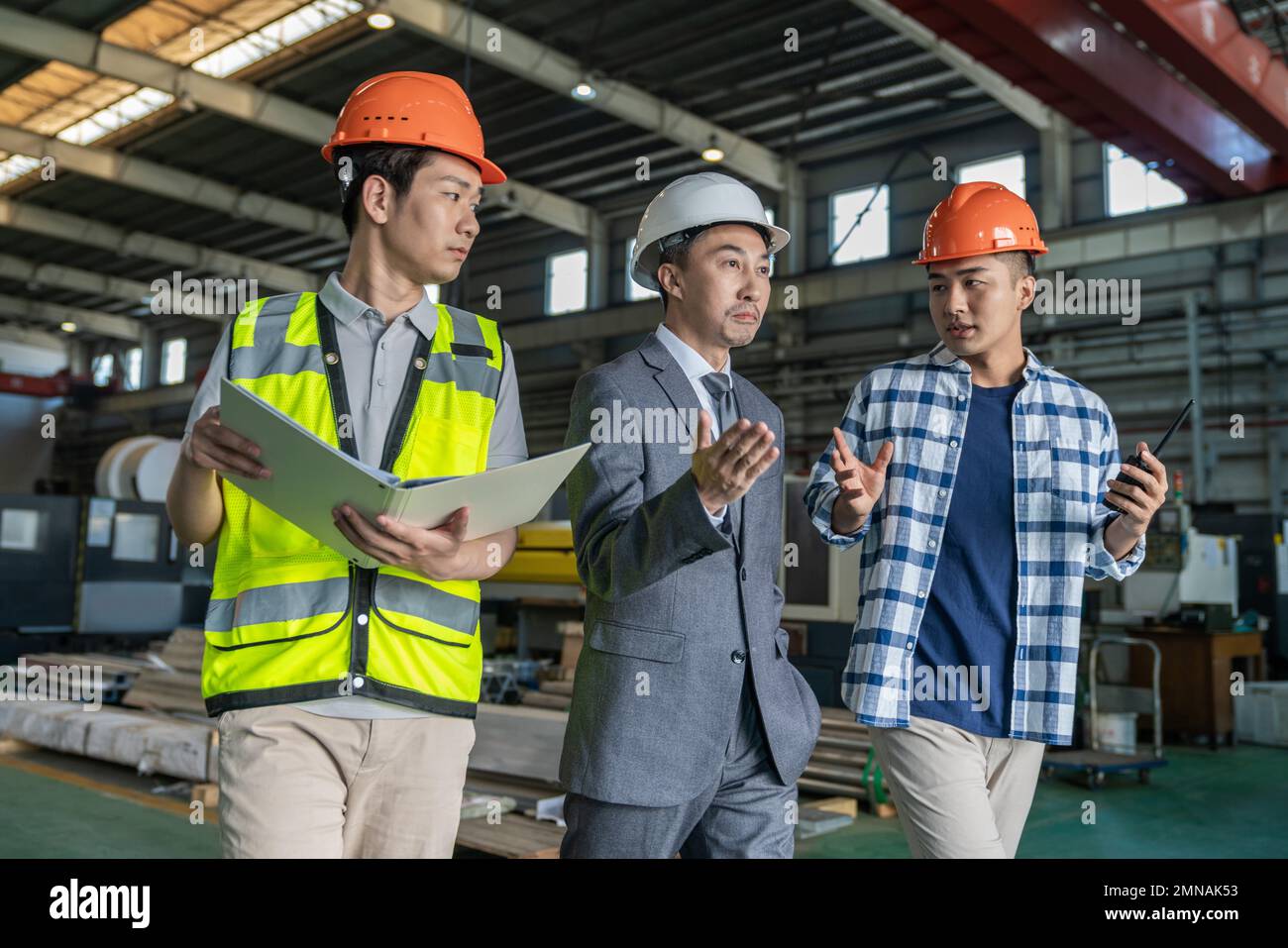 Three architects in the work Stock Photo - Alamy