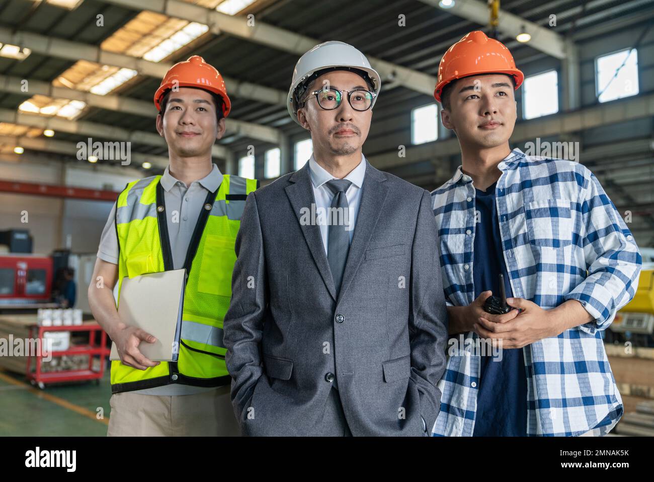 Three architects in the work Stock Photo - Alamy