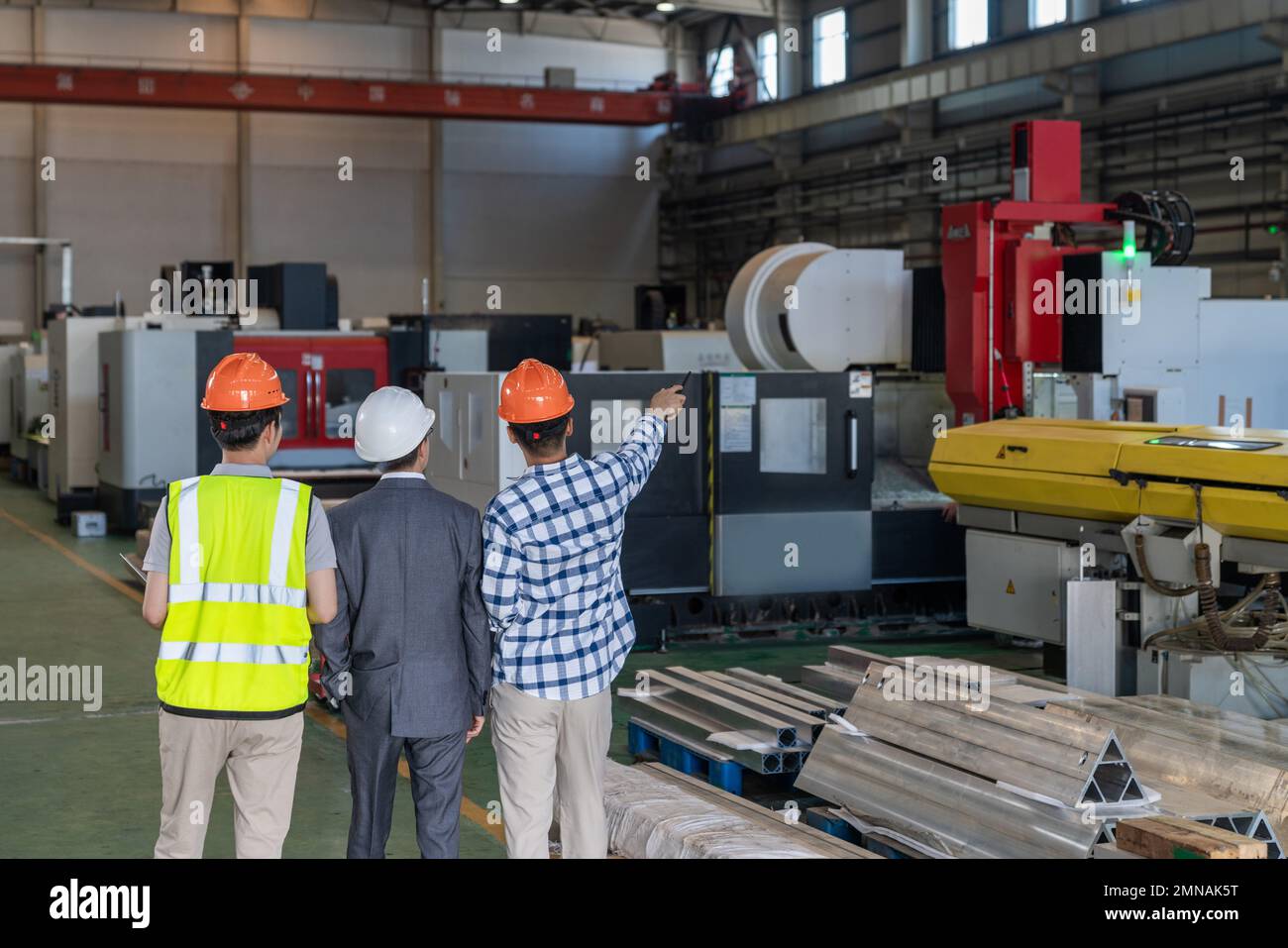 Three architects in the work Stock Photo - Alamy