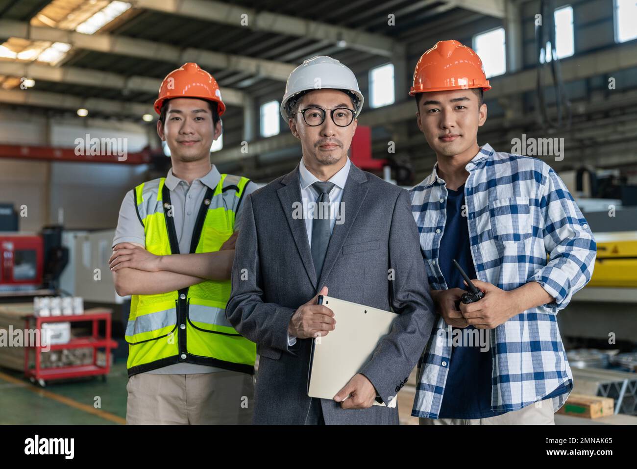 Three architects in the work Stock Photo - Alamy