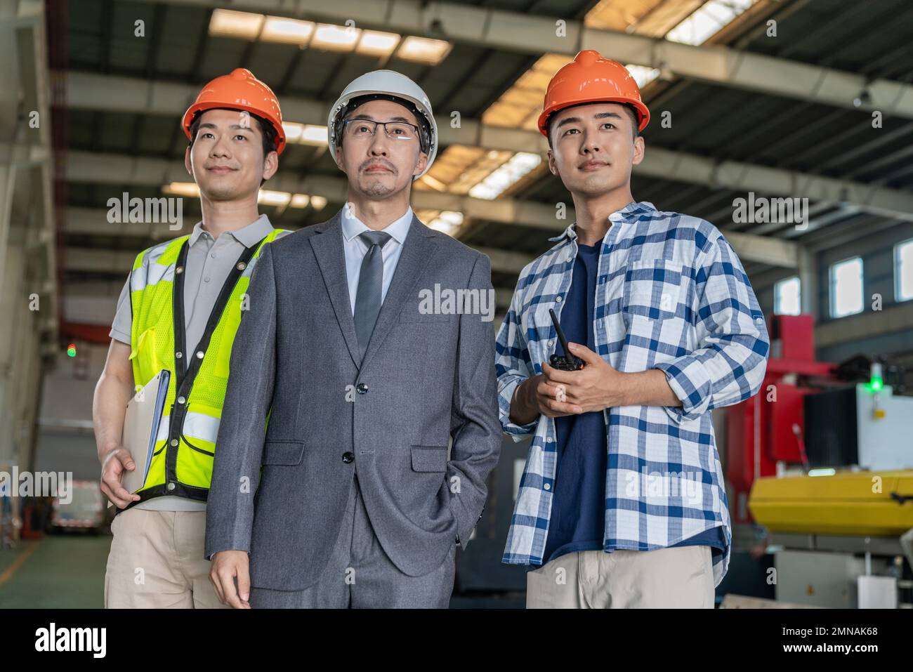 Three architects in the work Stock Photo - Alamy