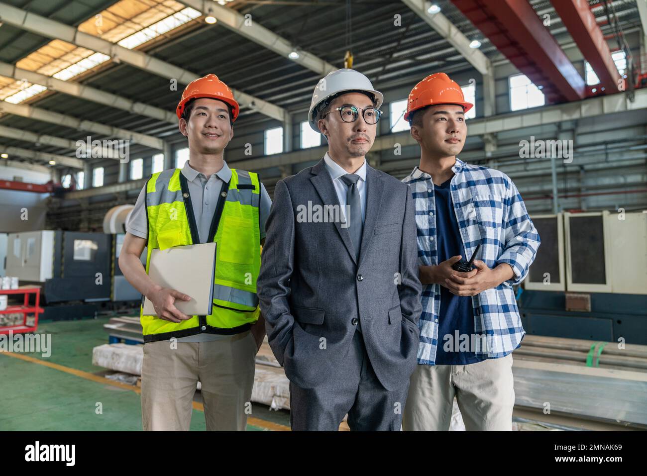 Three architects in the work Stock Photo - Alamy
