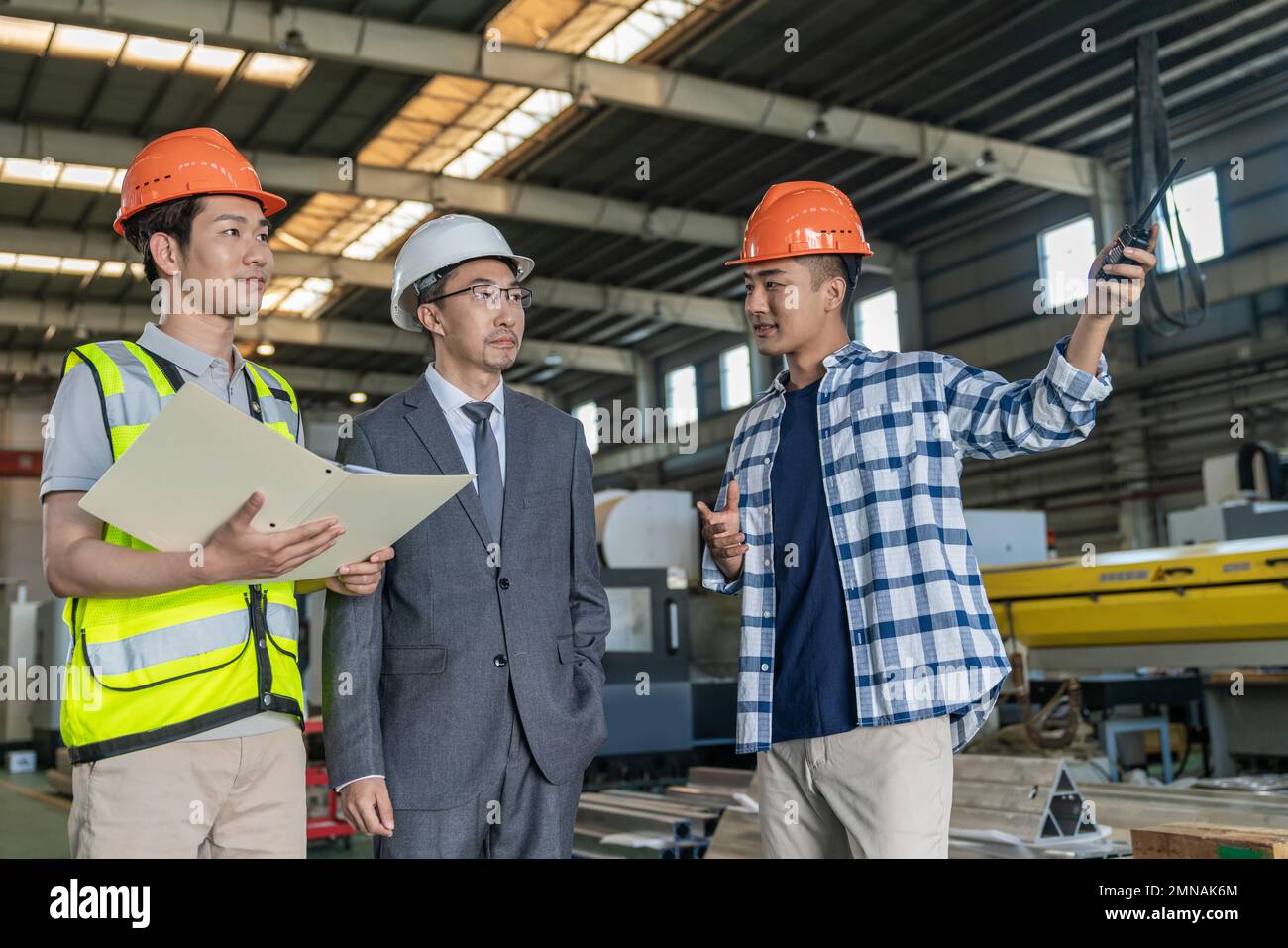 Three architects in the work Stock Photo - Alamy