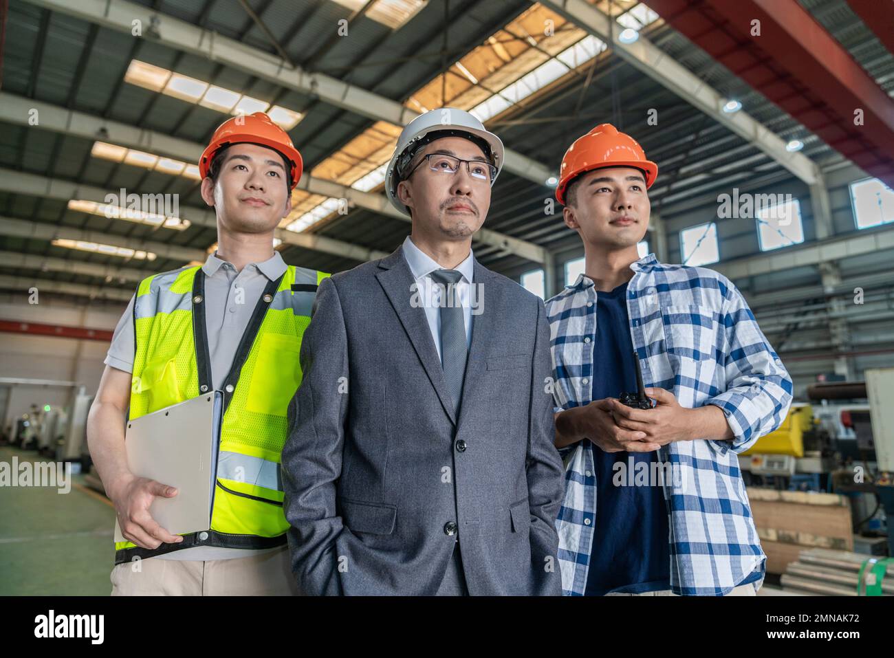 Three architects in the work Stock Photo - Alamy