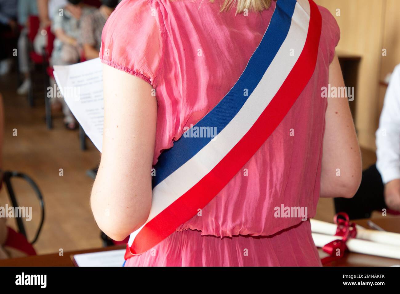 French blonde woman mayor with scarf france flag tricolor and girl pink ...