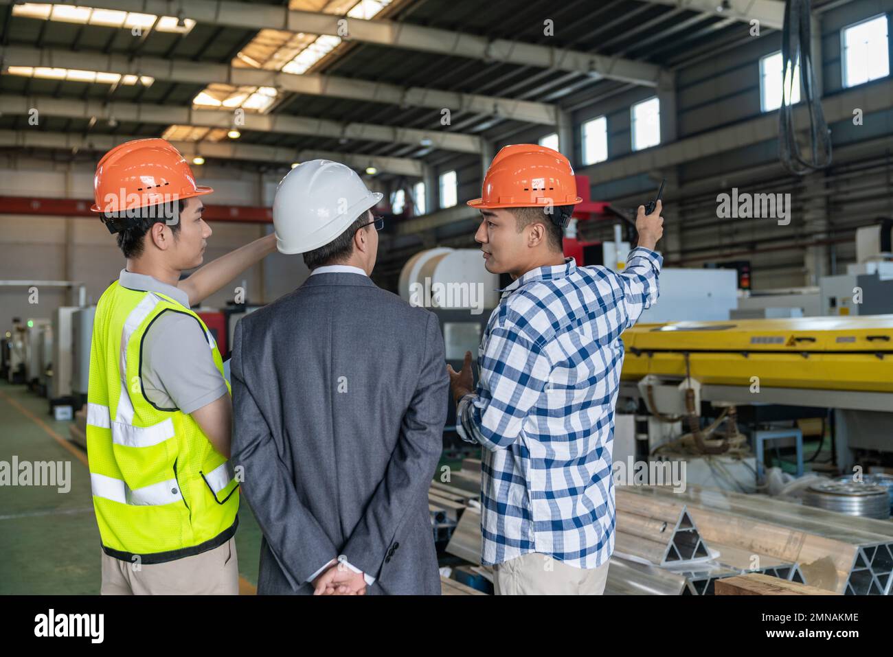 Three architects in the work Stock Photo - Alamy
