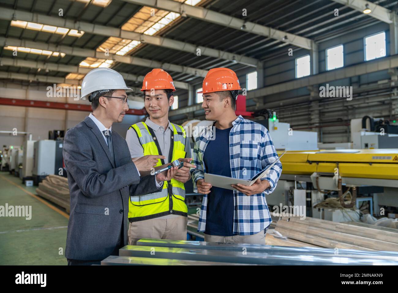 Three architects in the work Stock Photo - Alamy