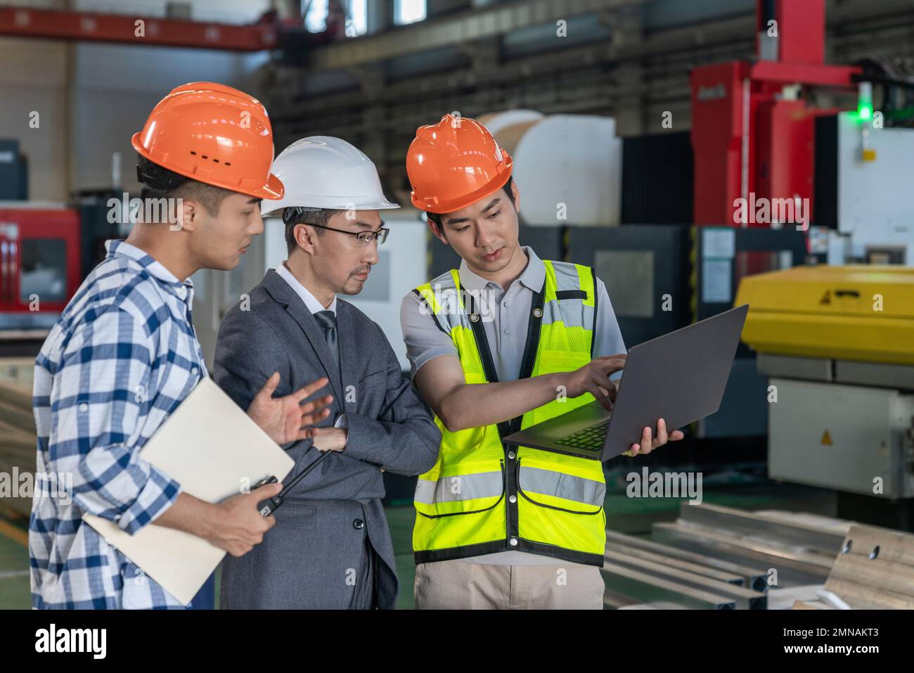 Three architects in the work Stock Photo - Alamy