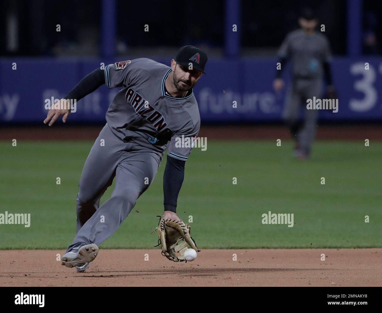Arizona Diamondbacks second baseman Daniel Descalso (3) fields a ground ...