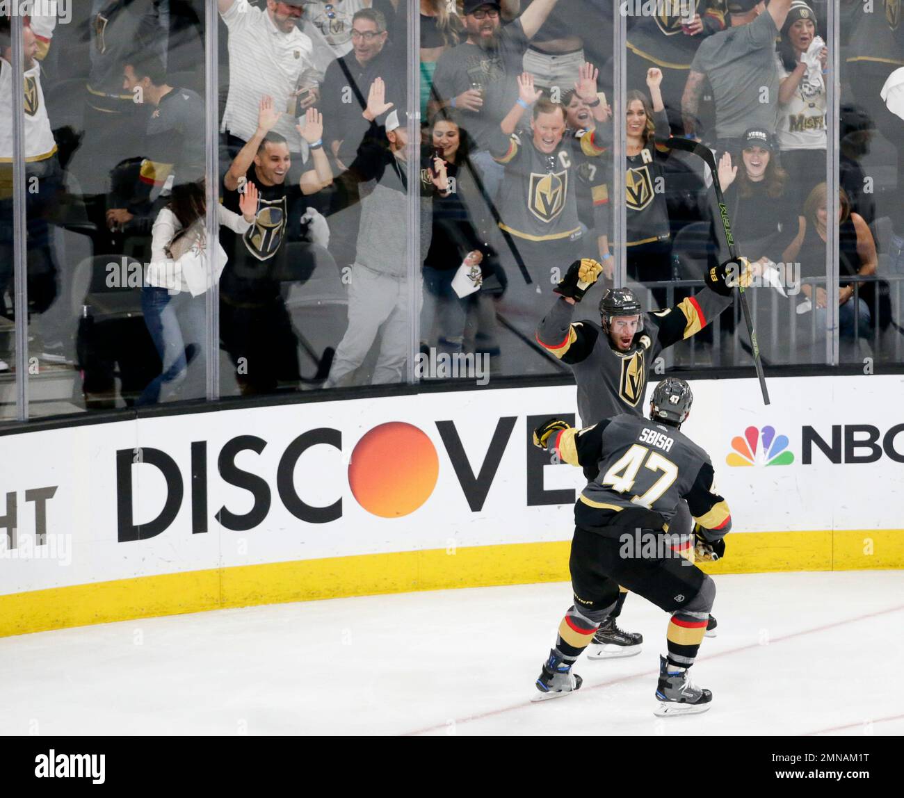 Vegas Golden Knights right wing Reilly Smith, back, celebrates his goal ...