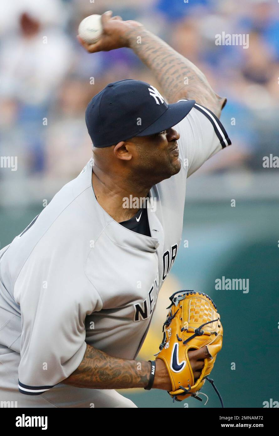 New York Yankees pitcher CC Sabathia throws to a Kansas City Royals ...