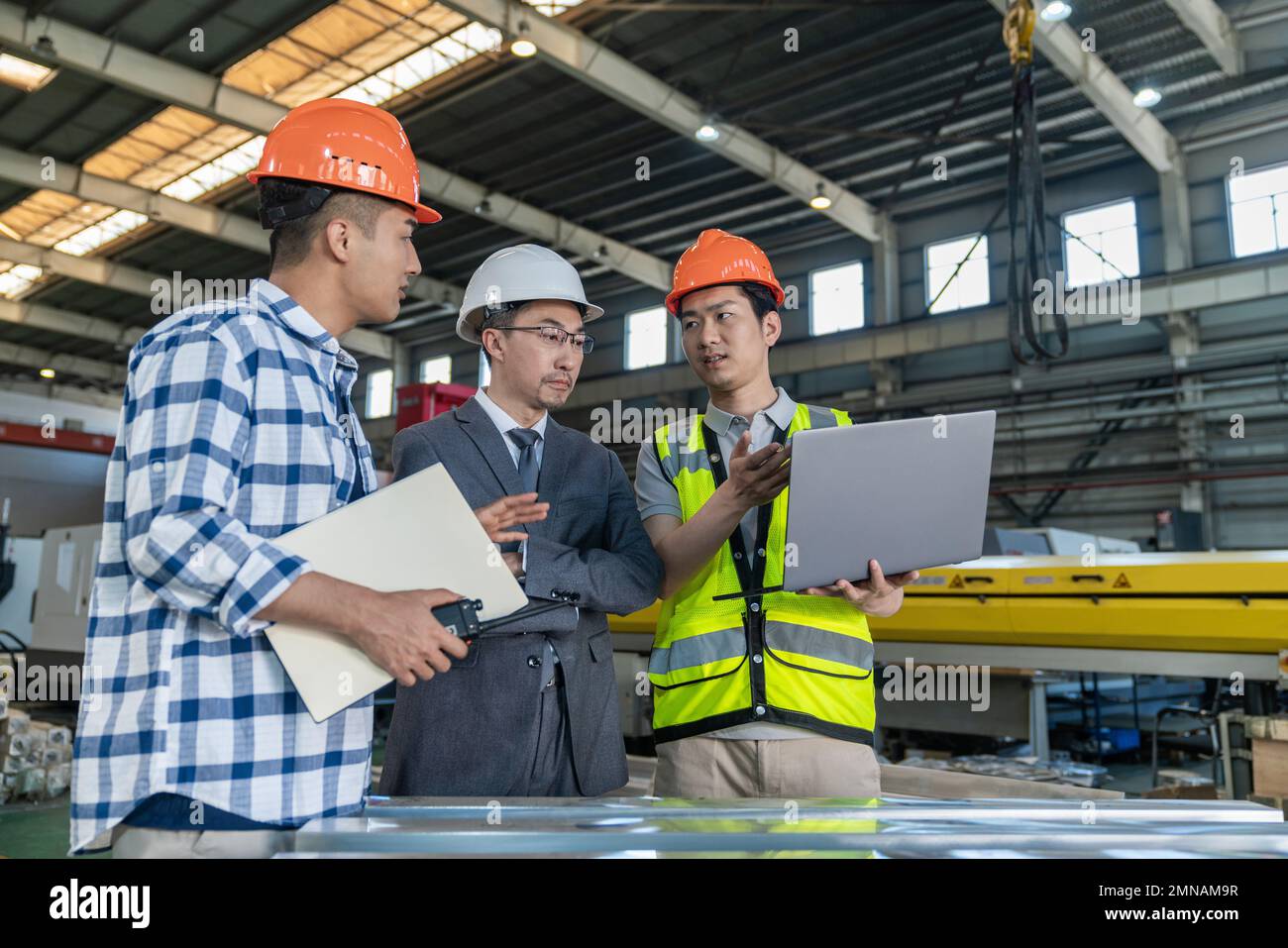 Three architects in the work Stock Photo - Alamy
