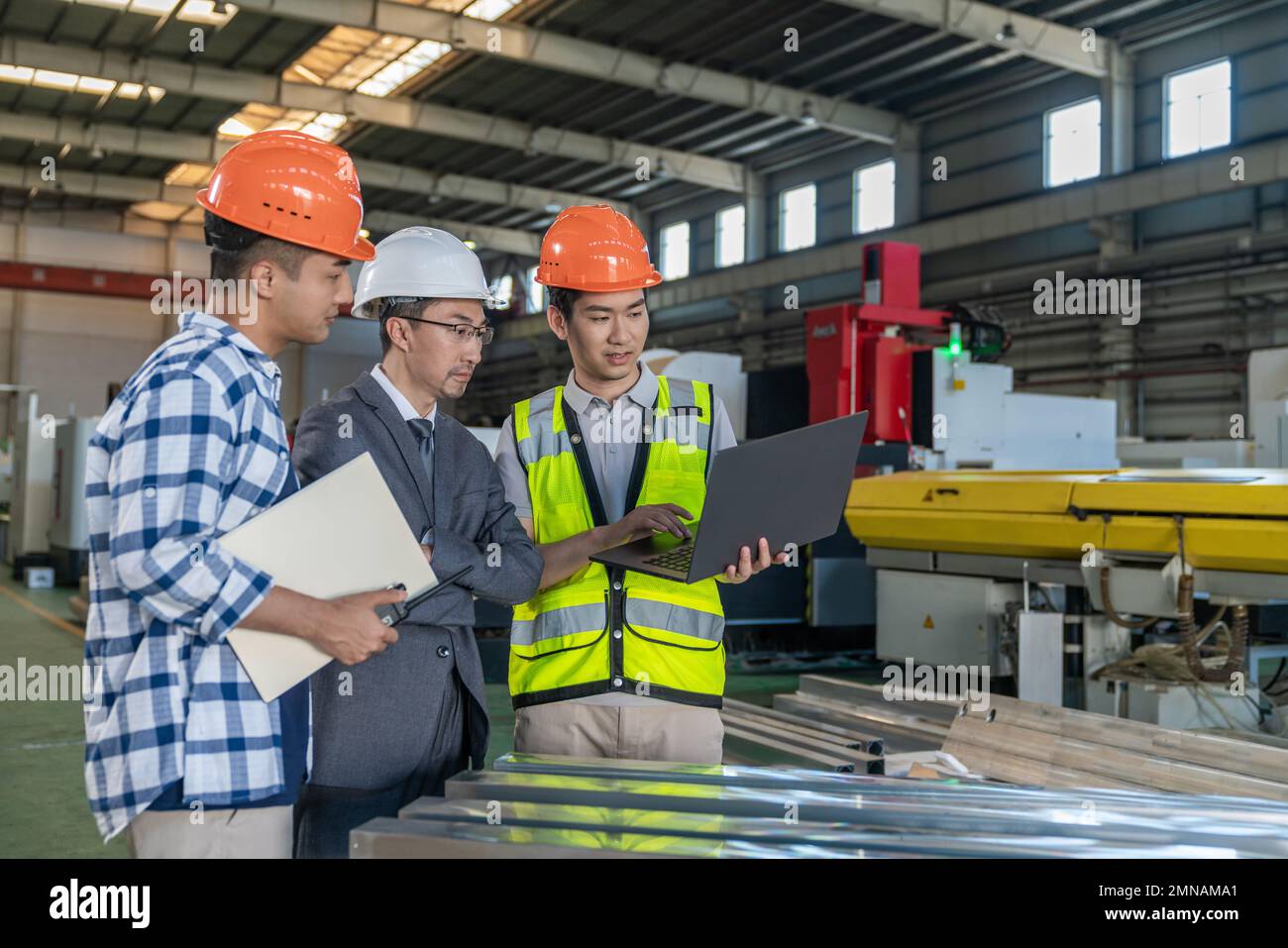 Three architects in the work Stock Photo - Alamy