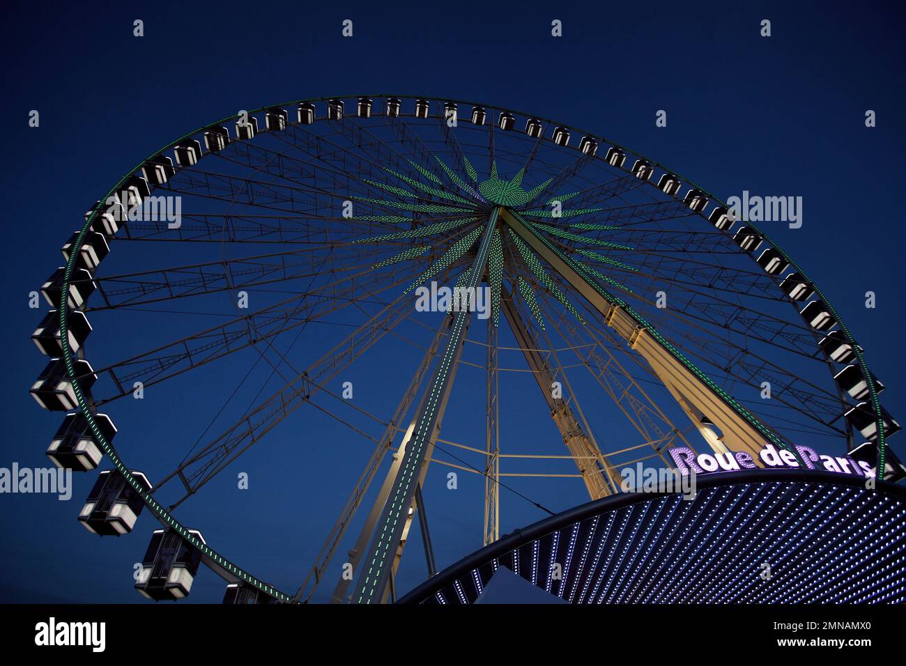 The ferris wheel is illuminated on the Concorde square in Paris, Friday ...