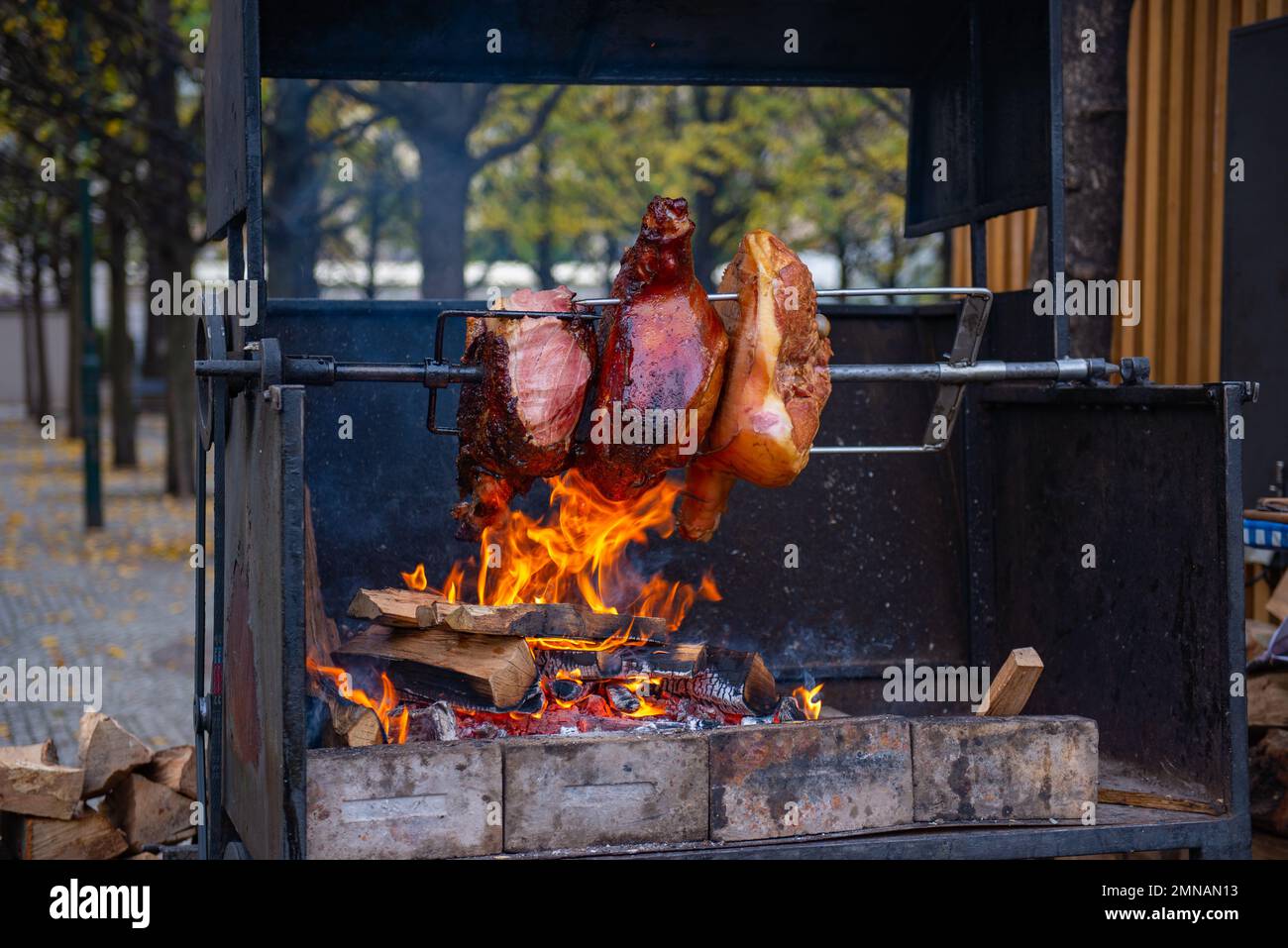 three pieces of meat fried on a spit Stock Photo - Alamy