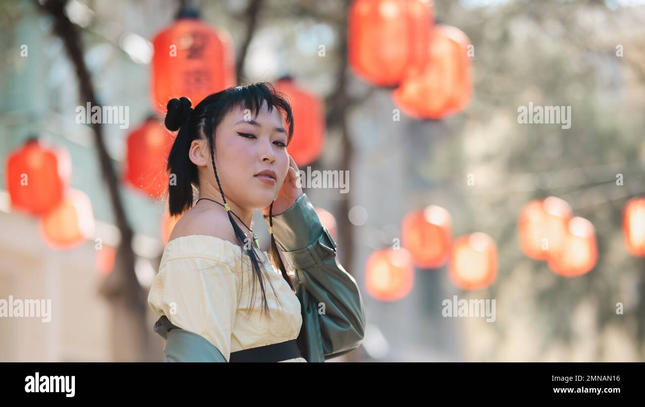 Portrait of an Asian woman against the background of Chinese lanterns ...