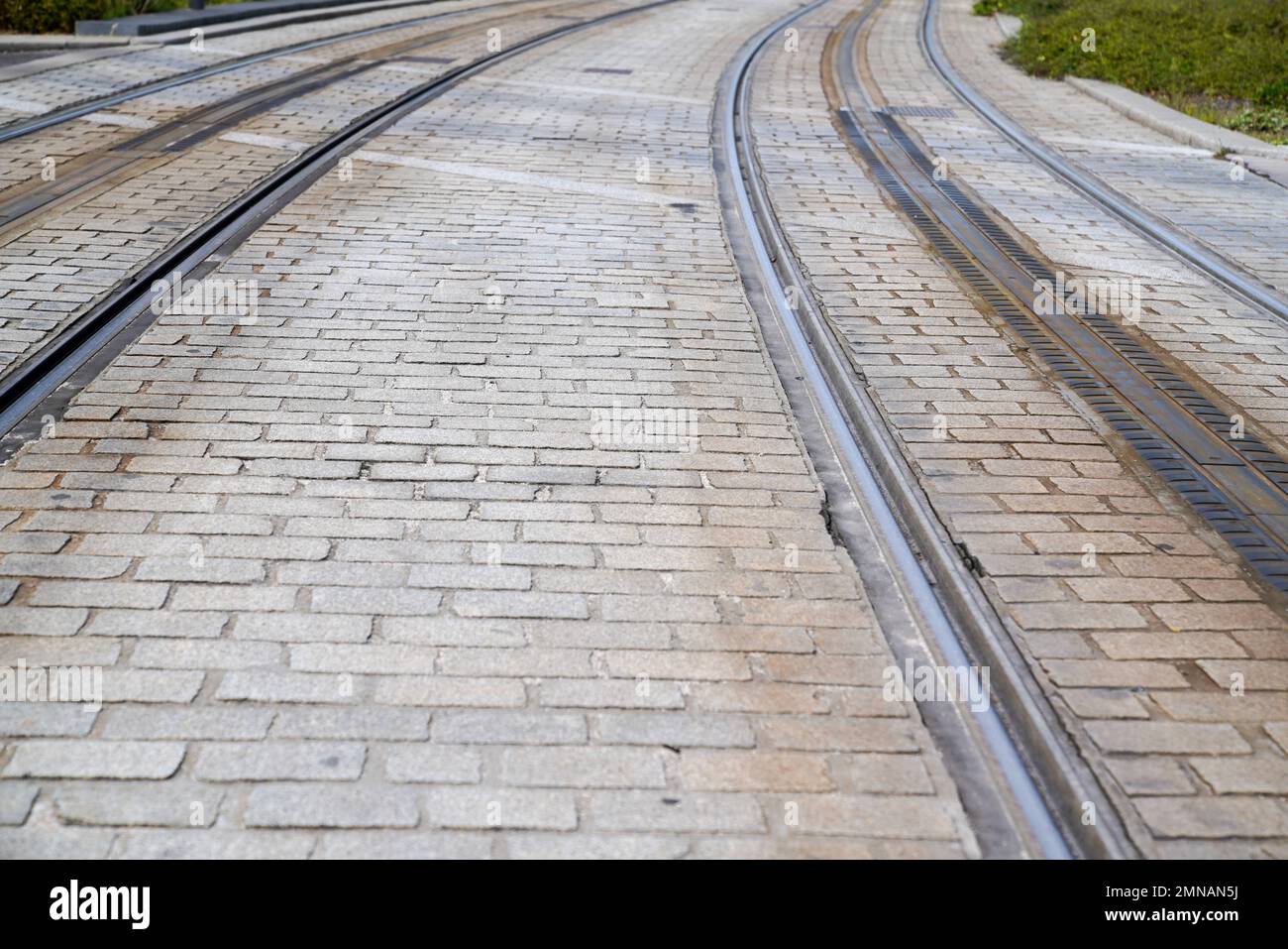 Ways for a city tram background rails between the pavers Stock Photo ...