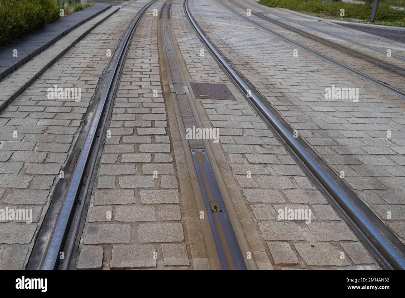 Railroad Tracks rails between the pavers in Old Street Stock Photo - Alamy
