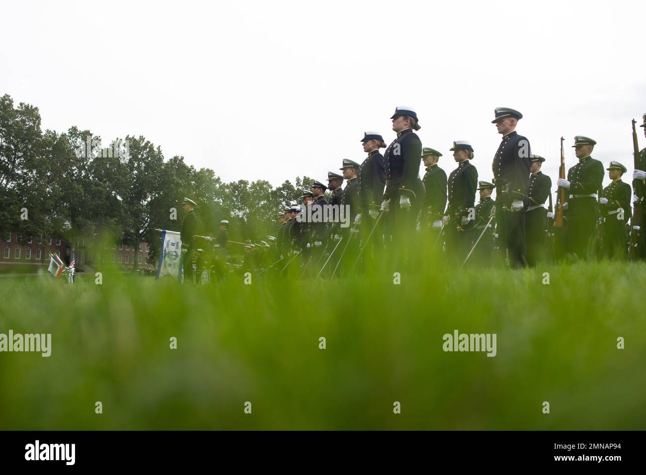 The Coast Guard Academy's Corps of Cadets stand in formation during a ...
