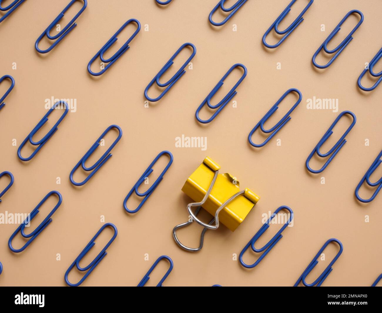Be different, be unique concept. Staples lie on the surface Stock Photo ...