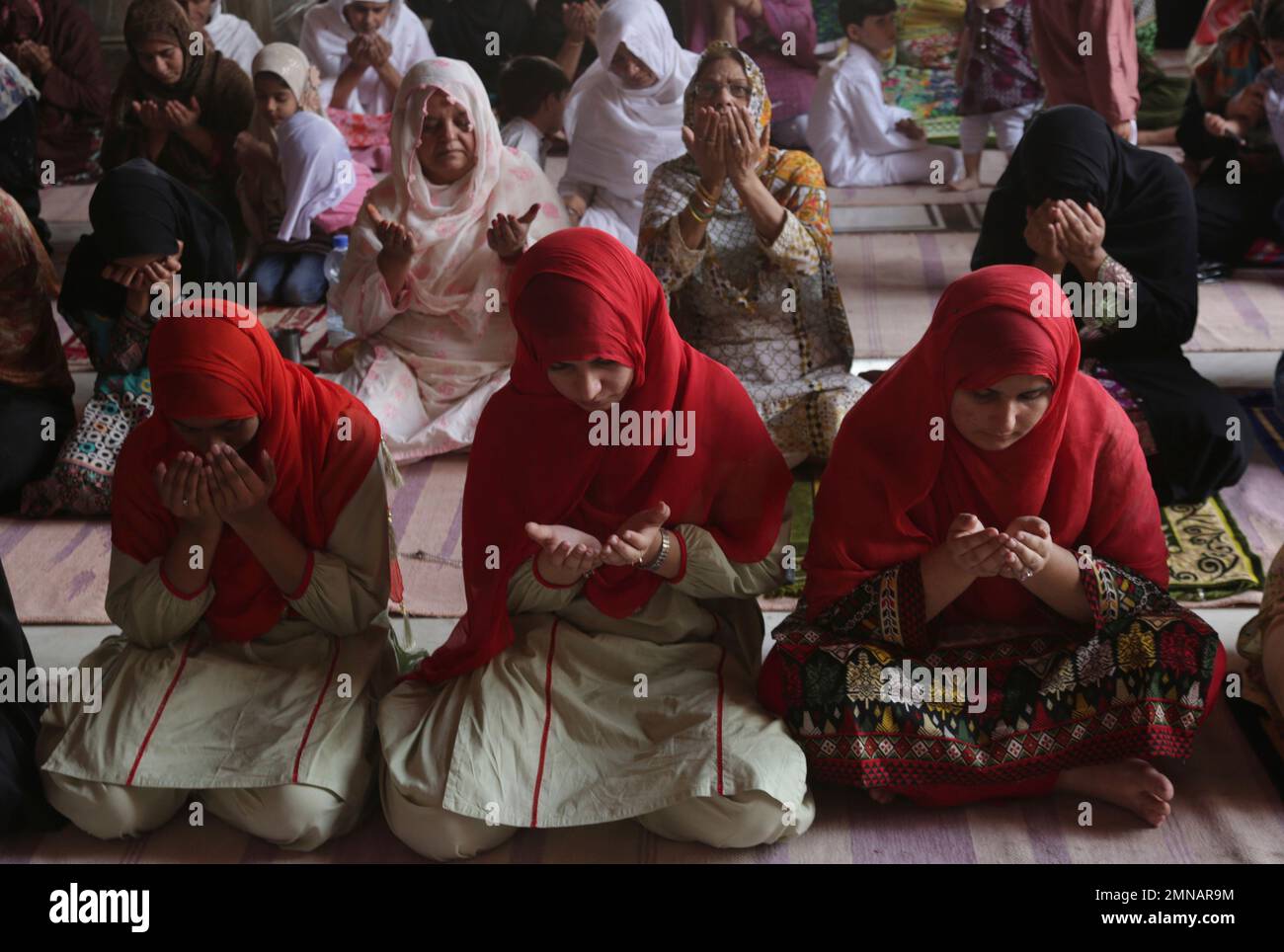 Pakistani Muslims offer prayers on the first Friday of Ramadan in ...