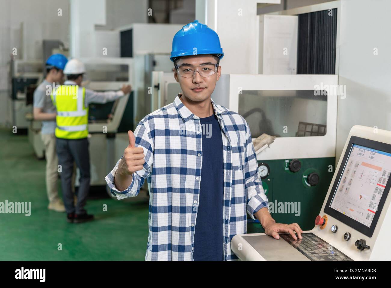 Engineers working in the factory Stock Photo - Alamy