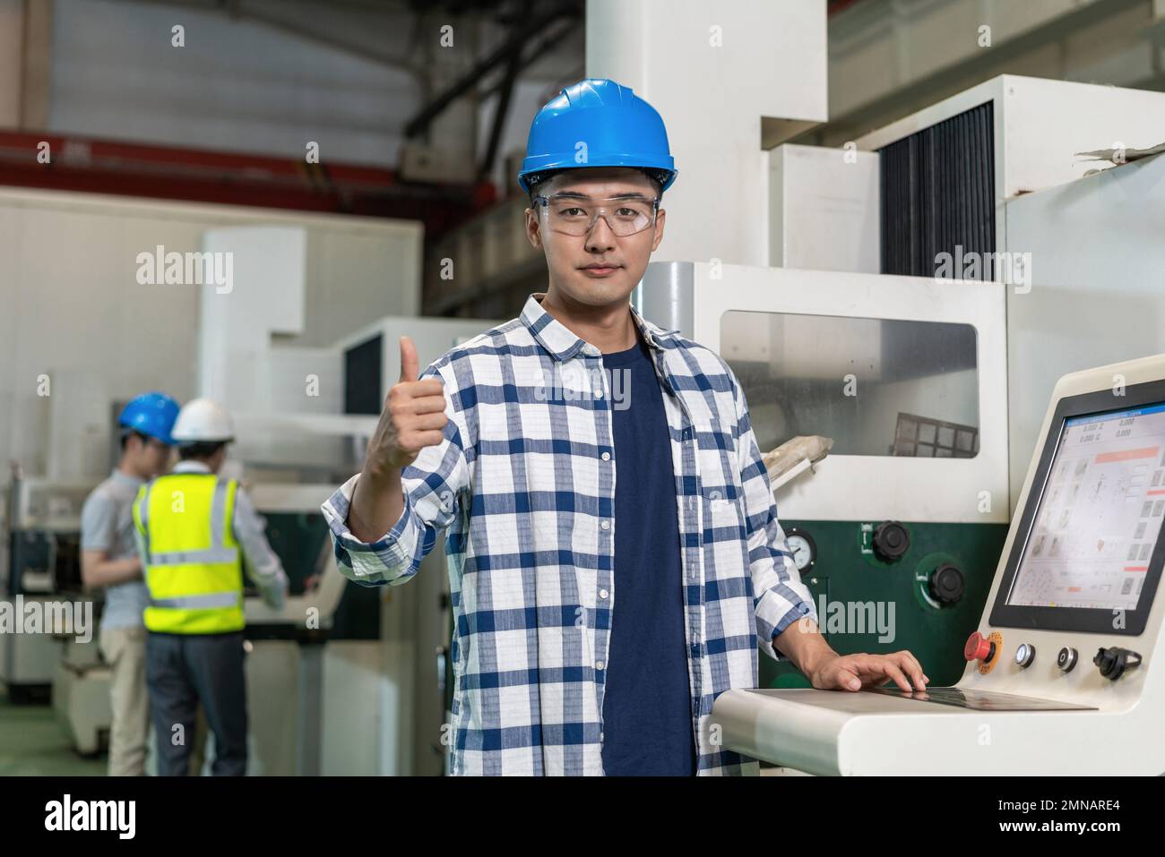 Engineers working in the factory Stock Photo - Alamy