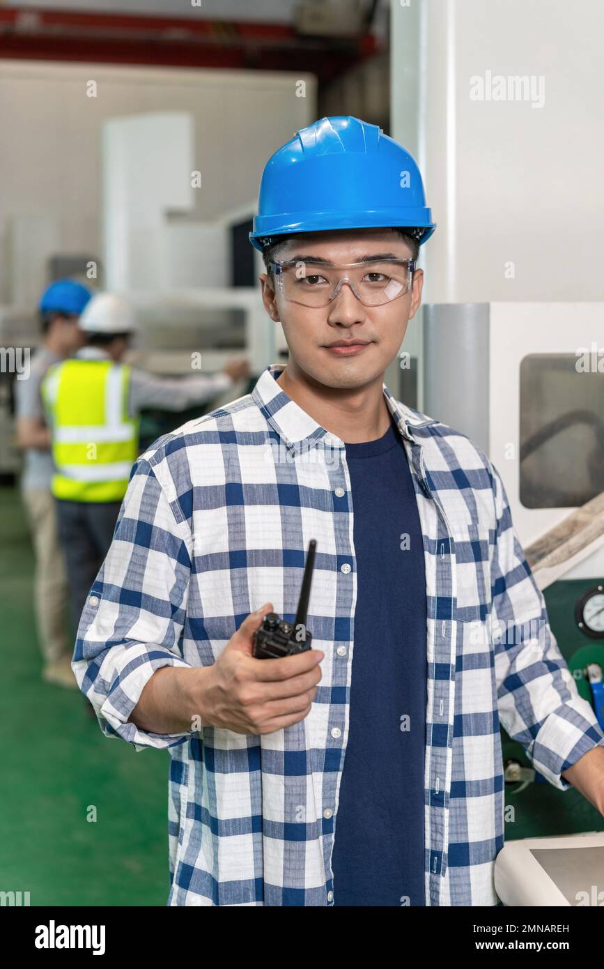 Engineers working in the factory Stock Photo - Alamy